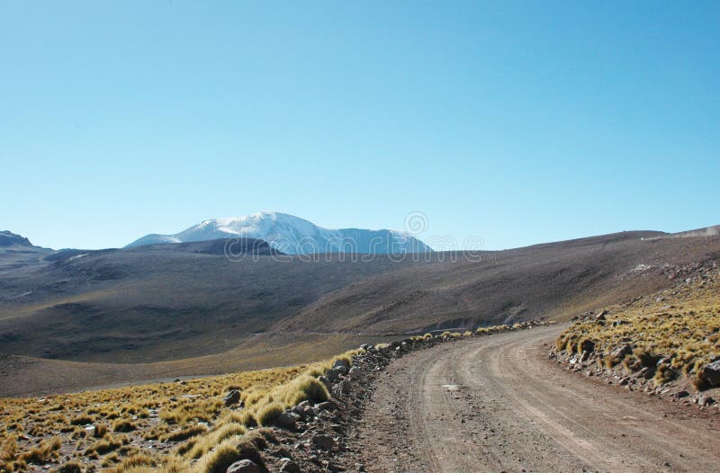 Rural Road in Mountains with Overhanging Clouds on a Sunny Day Stock ...