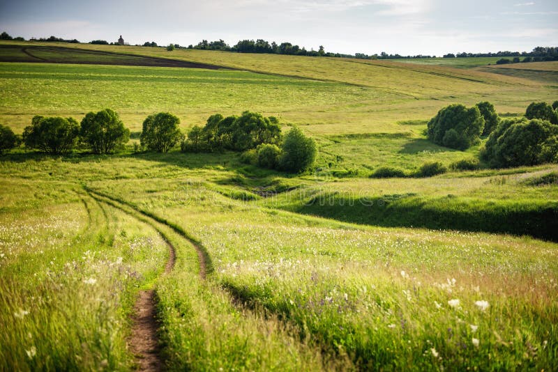Rural road over fields stock image. Image of field, land - 32052513