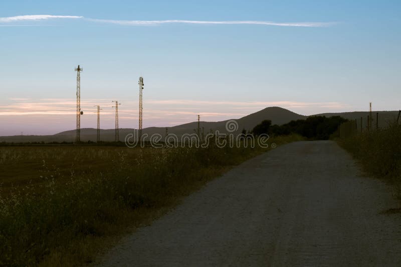 Rural Road with Power Lines at Dusk, Andalusia Stock Photo - Image of ...