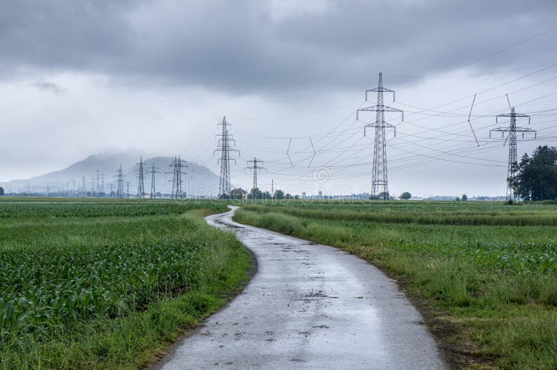 Rural road and power lines stock photo. Image of industrial - 98443962