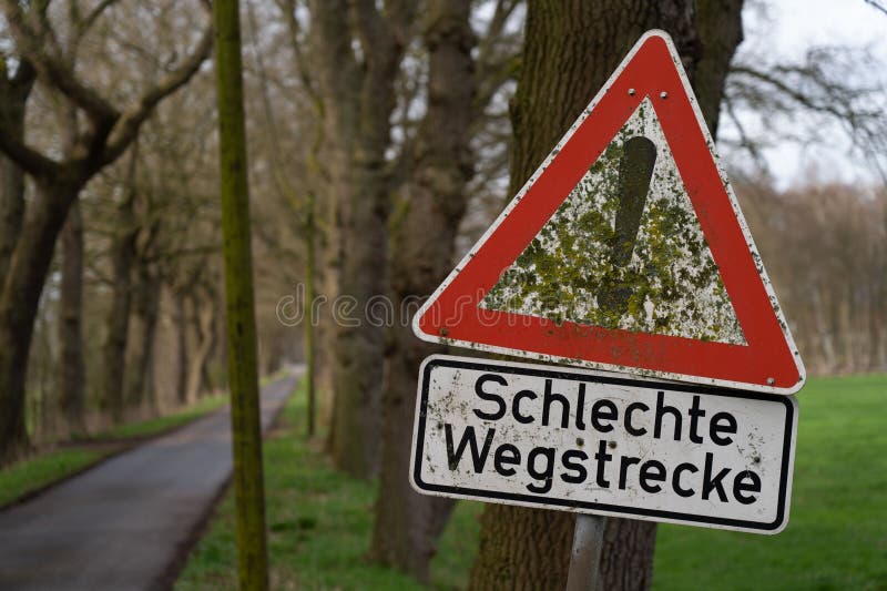 Rural Road Sign for a Bad Trail Situated on a Pole in a Forest Stock ...
