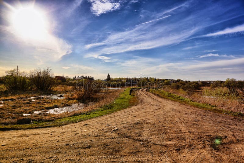 Rural road spring stock image. Image of blue, grass - 112510425