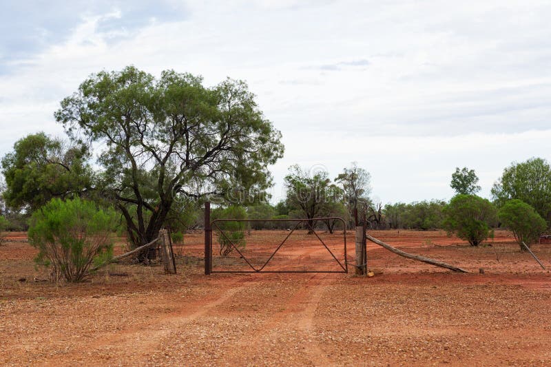 A Rural Scene in the Outback with a Gate and Fence in Typical Red ...