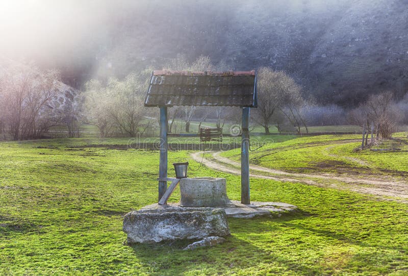 Rural scenery with well stock image. Image of grassland - 92375387