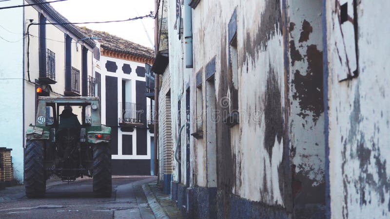 Rural Street with Tractor and Old Buildings Stock Image - Image of ...