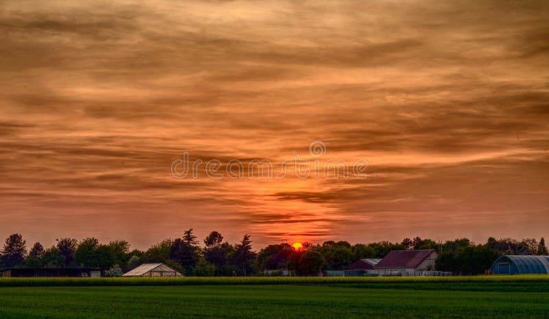 Rural Sunset Over a Green Meadow Stock Photo - Image of grass, outside ...
