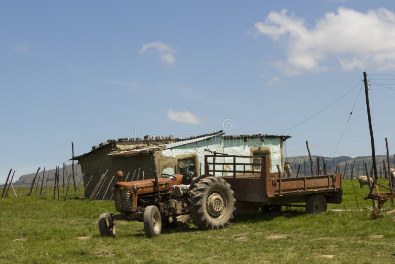 Rural Village House with a Tractor Stock Photo - Image of xhosa, grass ...