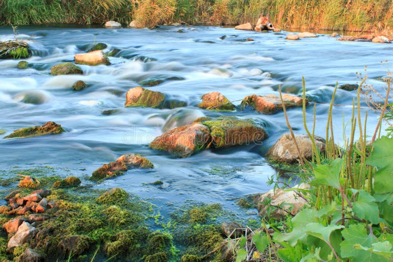 Rushing river stock image. Image of stream, boulder, idyllic - 57943619