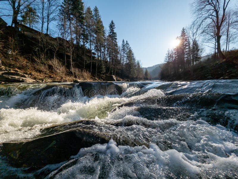 Rushing River Over Rocks in Forest with Mountains Stock Photo - Image ...