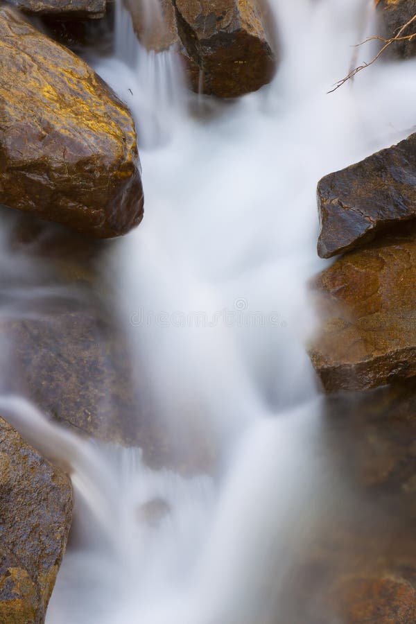 Rushing Large Waterfall with Huge Rocks in the Mountains Stock Photo ...