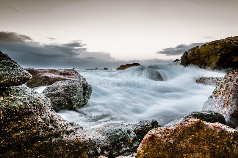 Rushing Water and Clouds in Laguna Beach, CA Stock Photo - Image of ...
