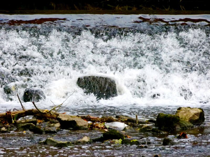 Rushing Waterfall with Rocks and Rocks in Front of it Stock Photo ...