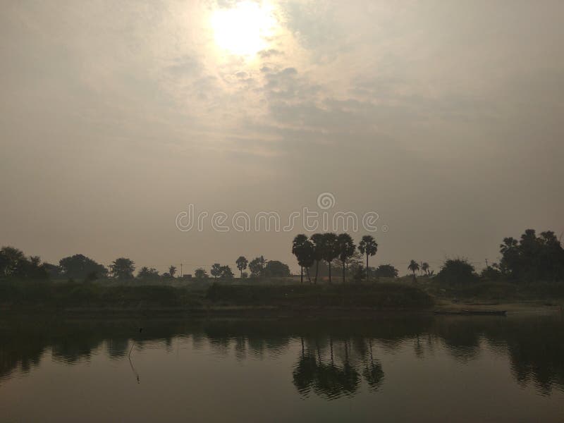 Rising sun stock photo. Image of water, shadow, river - 130836994