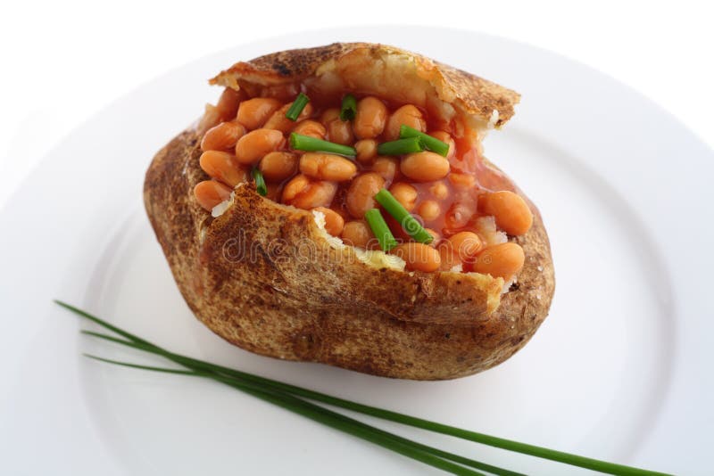 Russet Baked Potato with Beans and Chives Stock Photo - Image of plate ...