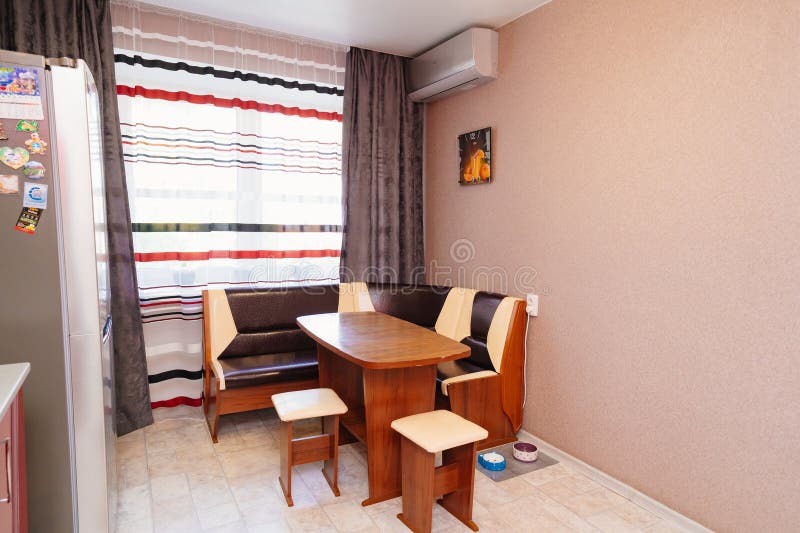 Dining Area in the Kitchen. Table with Sofa and Stools Editorial Image ...