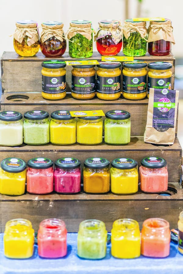 On the Shelves are Multi-colored Jars with Peanut Paste. Editorial ...