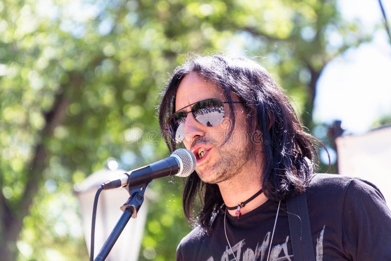 Unknown Singer Sings into the Microphone in the Park Editorial ...