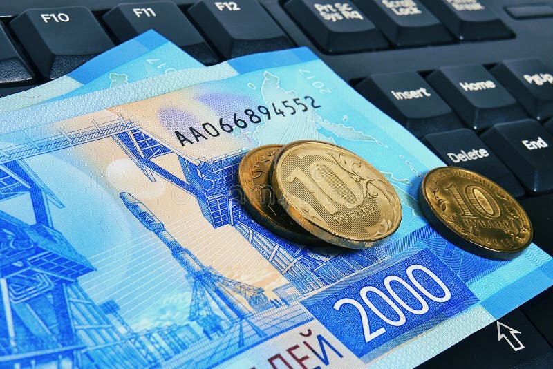 Russian Banknotes and Coins on the Computer Keyboard. Remote Work ...