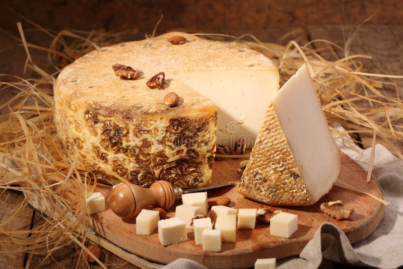 Russian Cheese with Nuts on a Wooden Table Stock Image - Image of hunk ...