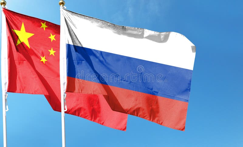 Russian and Chinese Flags Flutter Under Cloudy Skies. Stock Photo ...
