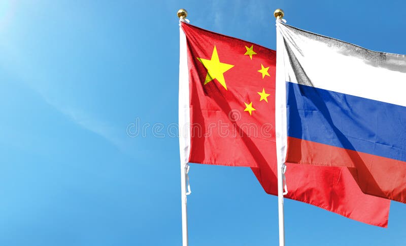 Russian and Chinese Flags Flutter Under Cloudy Skies. Stock Image ...