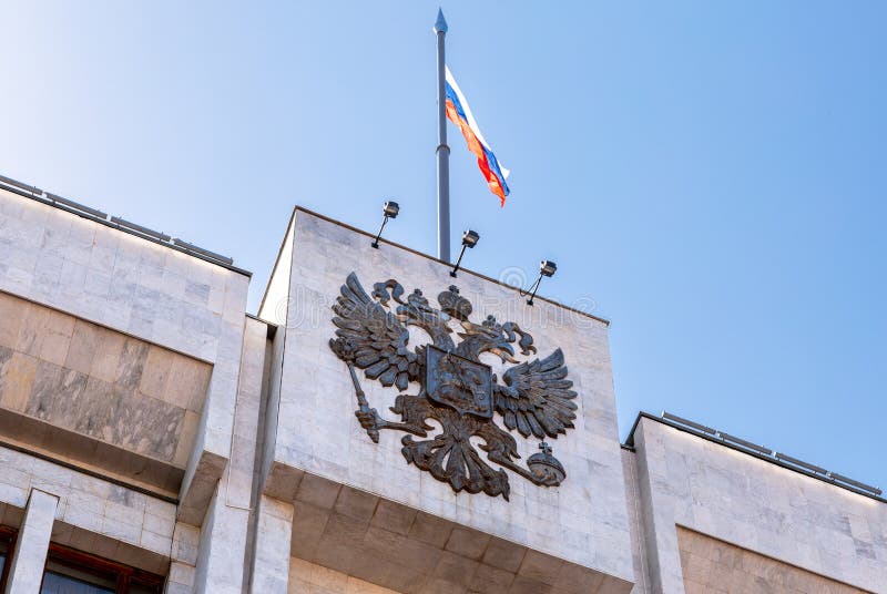 Russian Coat of Arms and the State Flag on the Building Editorial Stock ...