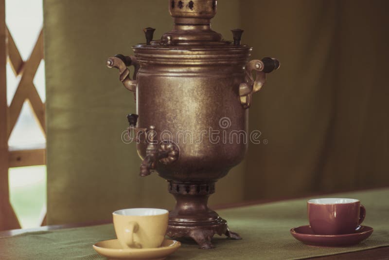 Russian Copper Samovar and Tea Cups on the Table Stock Photo - Image of ...