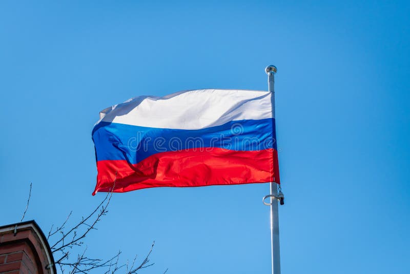 Russian Flag Against the Blue Sky. Flag of the Russian Federation Stock ...