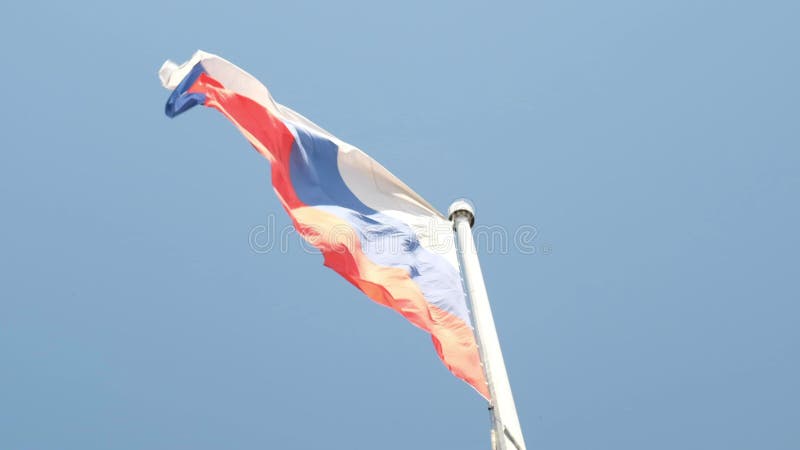Russian Flag Against the Sky, Flag on a Flagpole Fluttering in the Wind ... Russian Flag Against the Sky, Flag on a Flagpole Fluttering in the Wind ...
