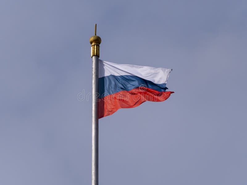 Russian Flag Fluttering in the Wind on a Flagpole Stock Image - Image ...