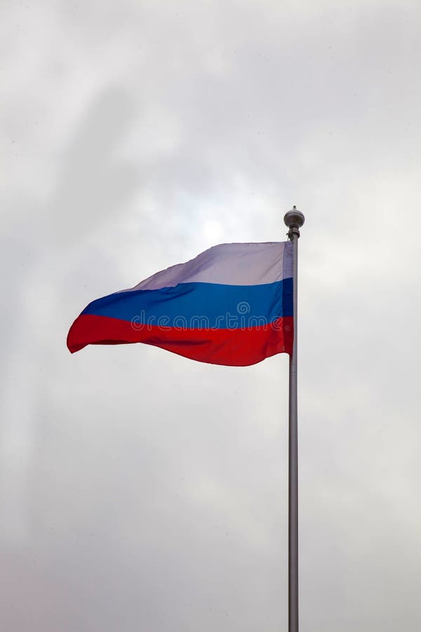 Russian Flag is Flying on a Flagpole Against the Sky Stock Image ...