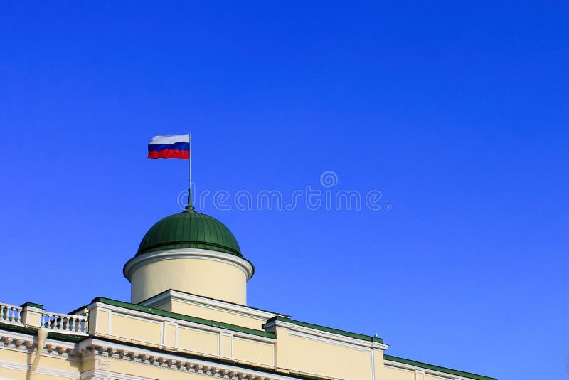 Russian Flag on the Roof of the Building. Clear Blue Sky. Stock Image ...