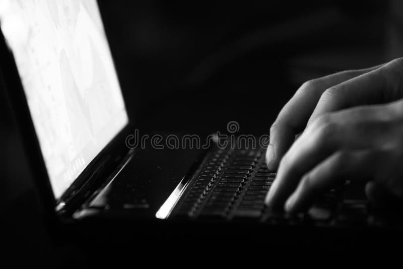 Russian Hacker Hacking the Server in the Dark Black and White Stock ...