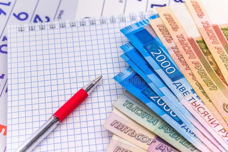Russian Money and a Notepad, a Red Pen and Russian Banknotes, a Clean ...