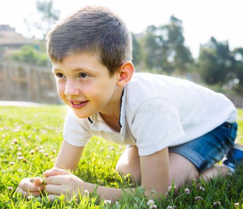 Boy sitting grass stock photo. Image of nature, carefree - 128563672