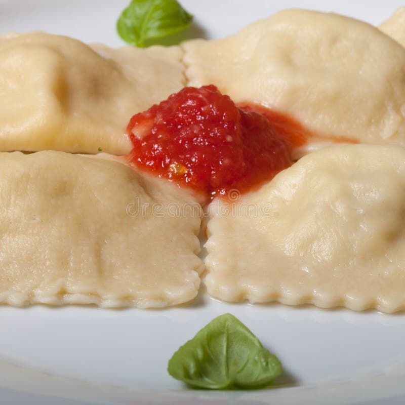 Russian Ravioli - Pelmeni with Tomato Sauce and Basil on a White Stock ...