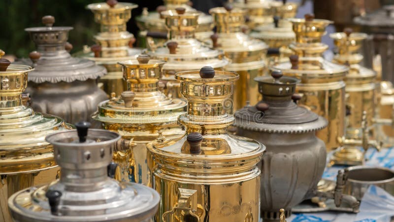 Russian Samovars Stand on the Table for Sale. Bronze Samovar. Stock ...