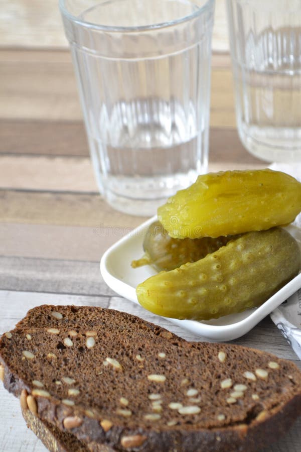 Russian Vodka in Glass with Black Bread and Pickles Cucumbers, Vertical ...