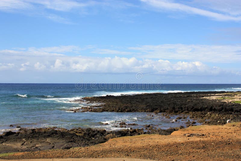 Rust Colored Soil and Volcanic Rock Lining the Pacific Ocean in Hawaii ...