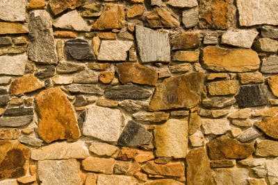 Rust Colored Stone Wall stock photo. Image of neutral - 3258474