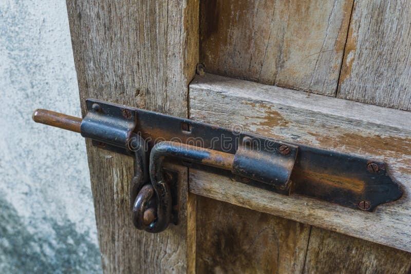 Rust Door Bolt on Wood Door Stock Image - Image of open, secure: 88702961