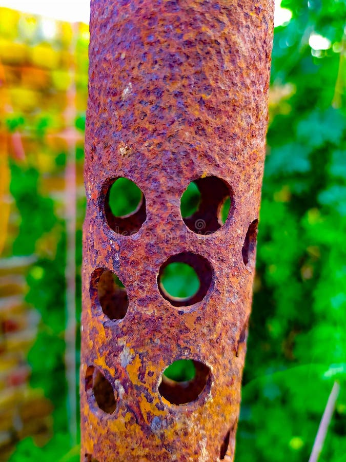 Rust Pipe with Holes Colorful Blur Background Stock Image - Image of ...