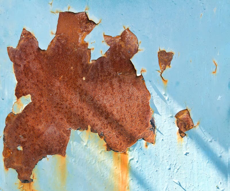 A Rust Stain on a Metal Surface Painted with Blue Paint. Stock Photo ...