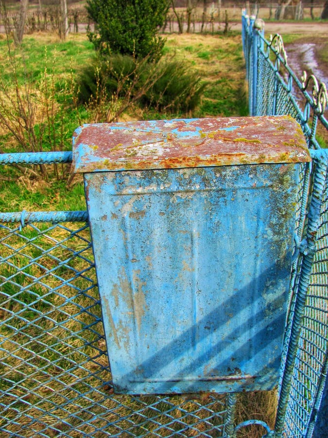 Vintage Mailbox on a Fence stock image. Image of weathered - 311670547