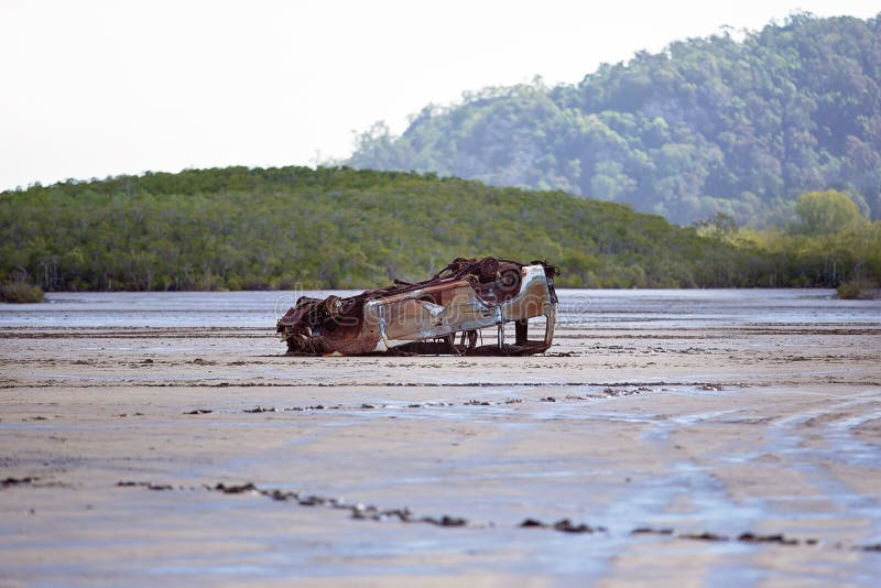 Rusted Car Wreck Upturned on the Mud Stock Image - Image of rustic ...