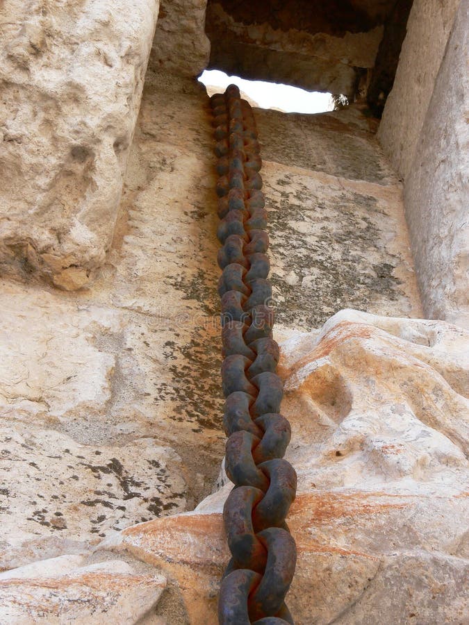 Rusted Chain Hanging on a Stone Wall Stock Image - Image of wall, heavy ...