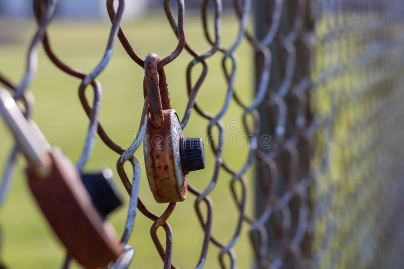 Rusted Combination Locks on Chain Link Fence. Stock Photo - Image of ...