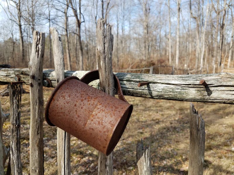 Rusted Metal Cup on Wood Fence with Old Nails Stock Image - Image of ...