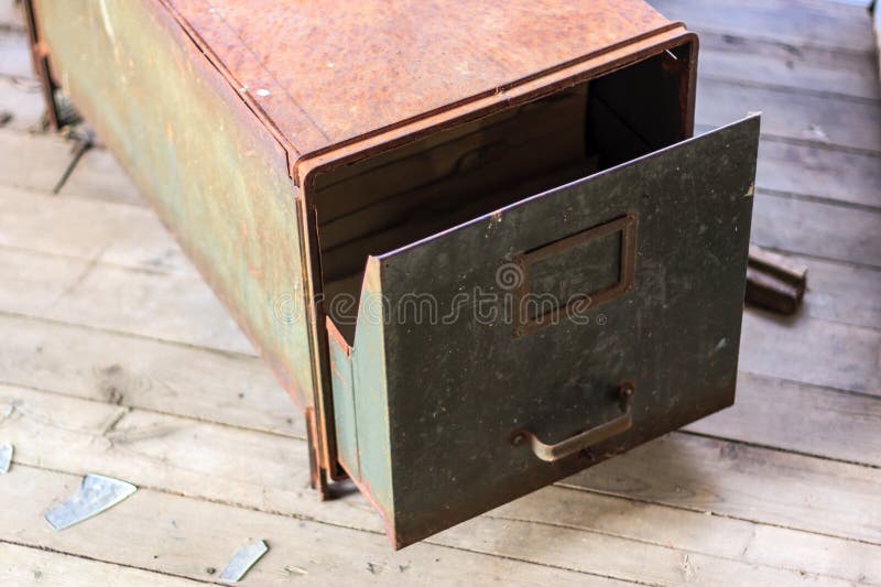 A Rusted Metal Filing Cabinet with a Drawer Open Stock Image - Image of ...