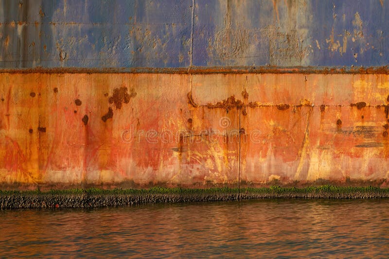 The Rusted Metal Hull of a Ship, Small Micro-organisms Adhering To the ...
